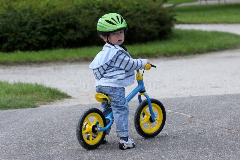 Learning To Ride on a First Bike Stock Photo - Image of park, outdoor ...