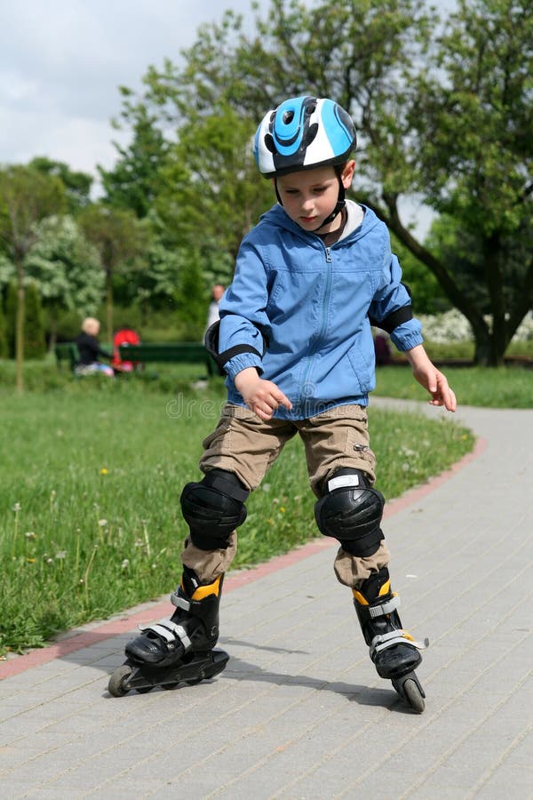 Kids Roller-Blading stock image. Image of childhood, grin - 2331065