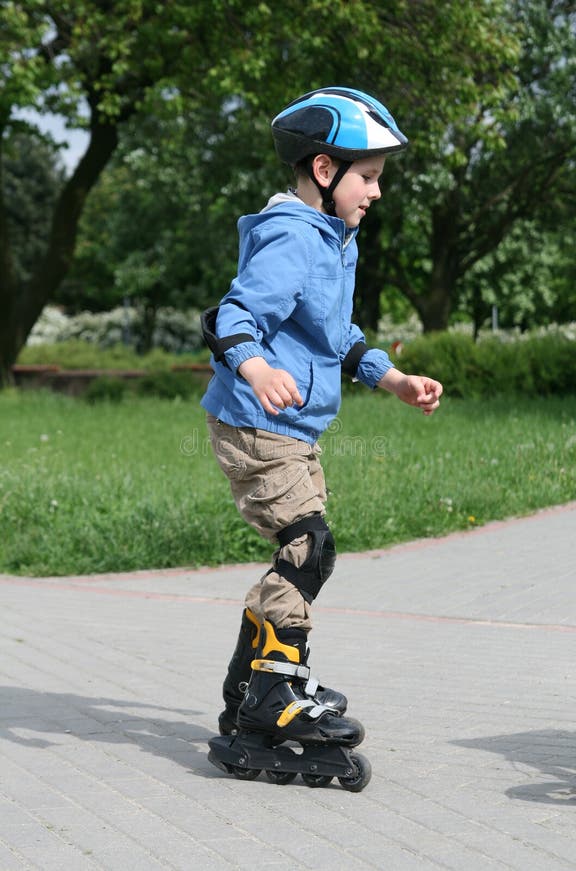 Learning To Ride on Rollerblades Stock Photo - Image of child ...