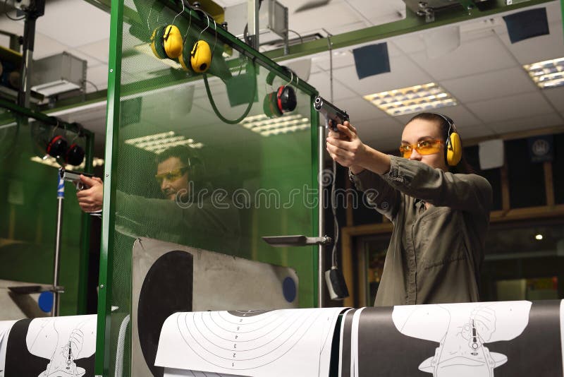 Learning to shoot a gun. stock photo. Image of automatic - 80072896