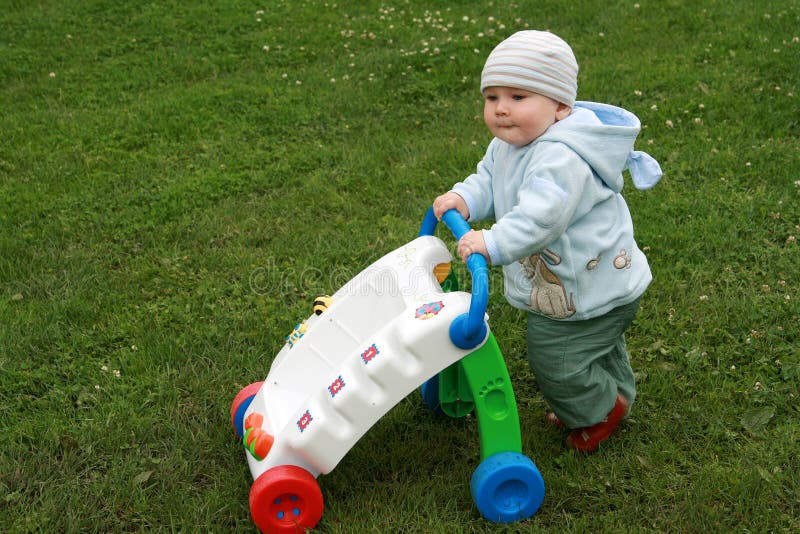 Learning To Walk - First Steps Stock Photo - Image of grass, babies ...
