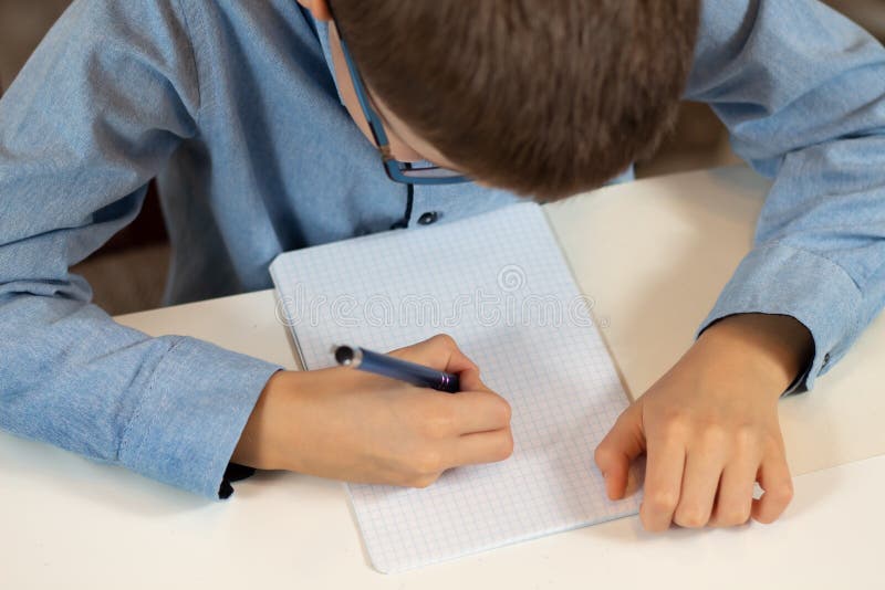 Hands of a Boy Training in Writing. Writing Letters with a Pen in a ...