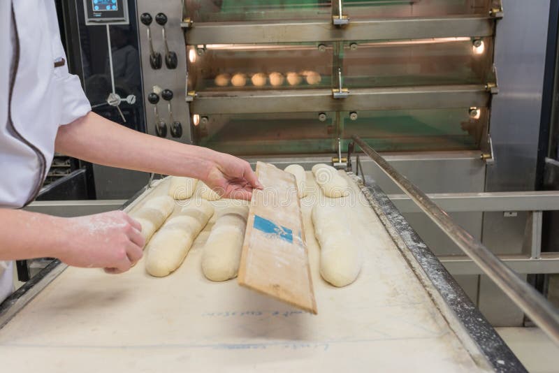 Apprentice Baker Hands Preparing Baguettes for Baking Stock Photo ...