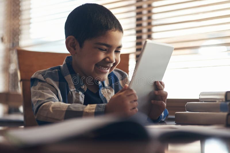 Learning in a Virtual Environment. an Adorable Little Boy Using a ...