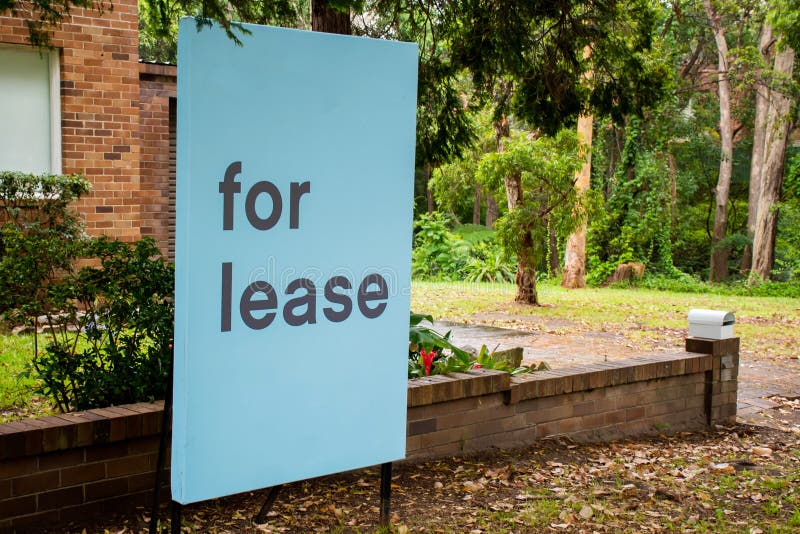 For Lease Sign on a Blue Display Outside of a Resedential Building ...