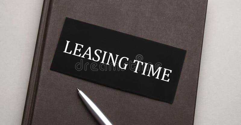 LEASING TIME Sign Written on the Black Sticker on the Brown Notepad ...