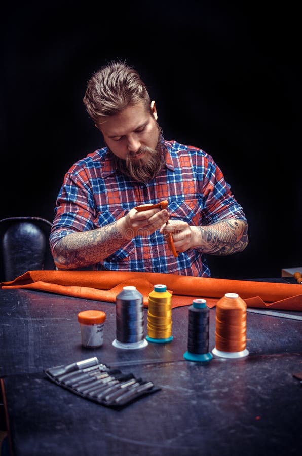 Leather Artisan Working with Leather Using Crafting Tools in the ...