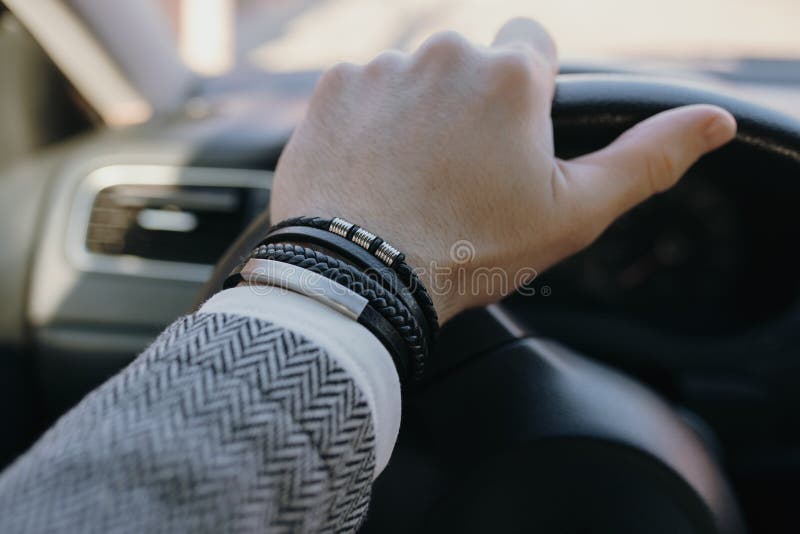 Leather Bracelet on the Male Driver Hand Stock Photo - Image of style ...