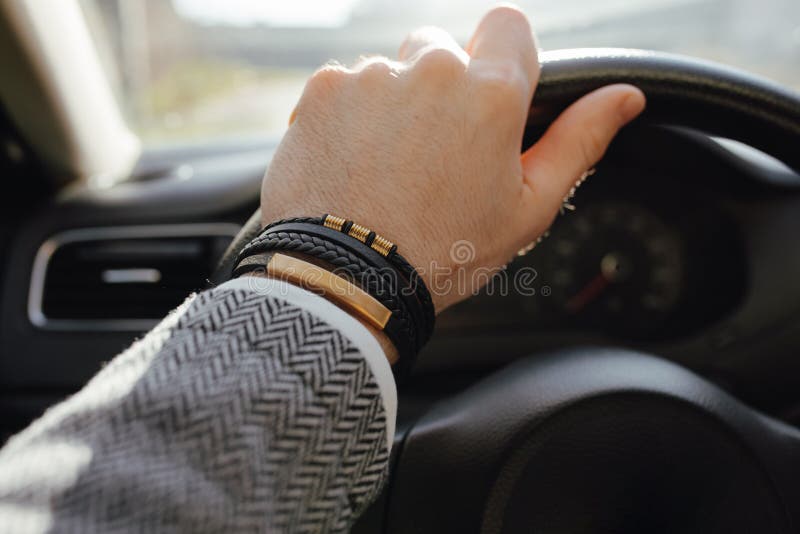 Leather Bracelet on the Male Driver Hand Stock Image - Image of wrist ...