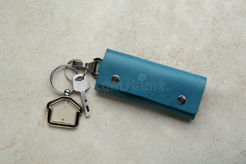 Leather Case with Key on Light Grey Table, Top View Stock Photo - Image ...
