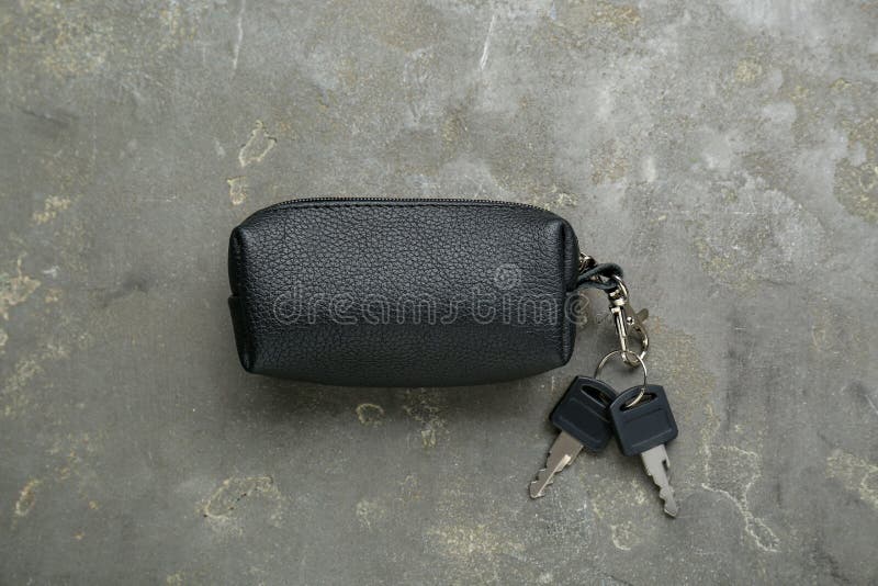 Leather Case with Keys on Grey Textured Table, Top View Stock Image ...