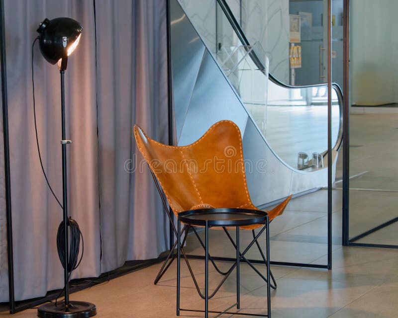 Leather Chair Placed Near a Table beside a Lamp Stock Image - Image of ...