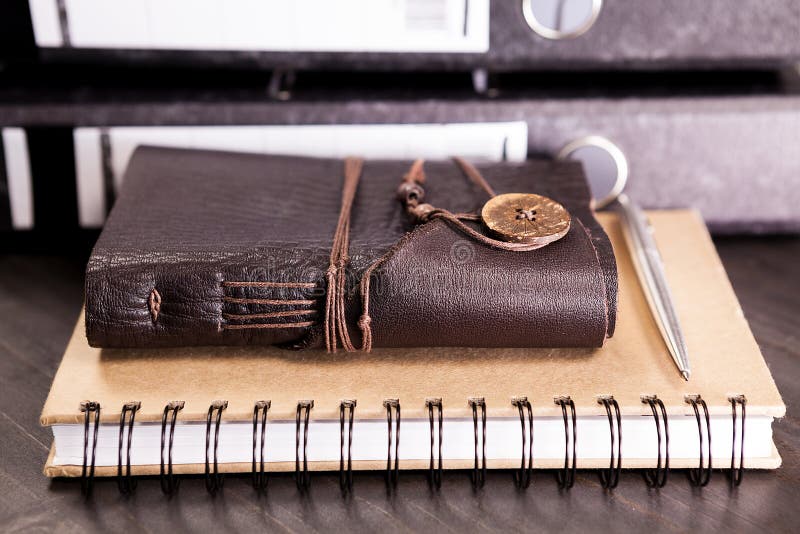 Leather Covered Vintage Retro Notebook Next To a Pile Stock Image ...