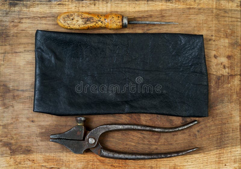 Leather Craft Tools on a Wooden Background. Craftmans Work Desk. Stock ...