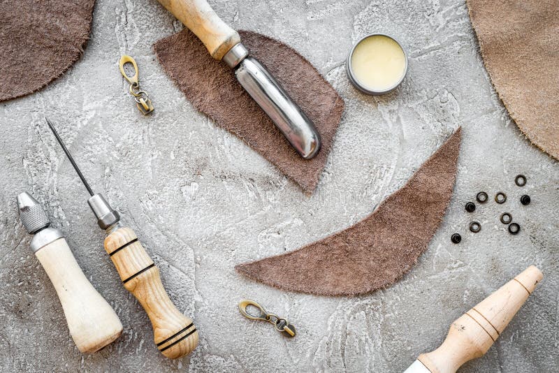 Leather Crafting Tools on Grey Stone Background Top View Stock Photo ...
