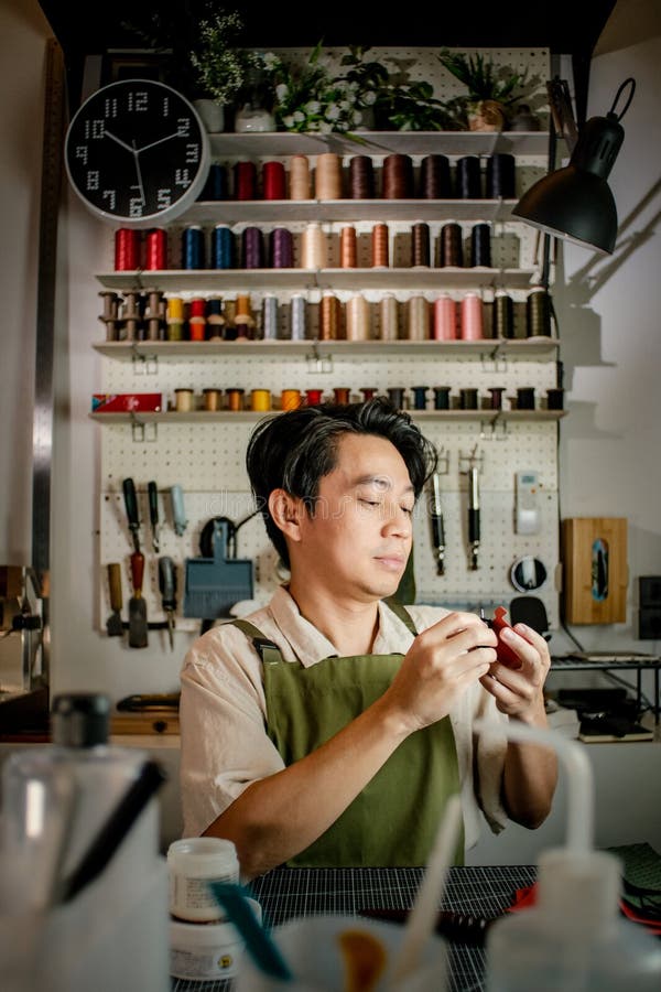 Leather Craftsman Working in Front of Tools Shelf Stock Image - Image of handcraft, shelf: 317026811