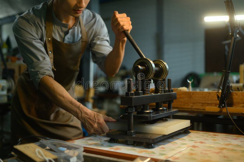 Leather Craftsman Working with Manual Leather Die Cutting Machine in ...