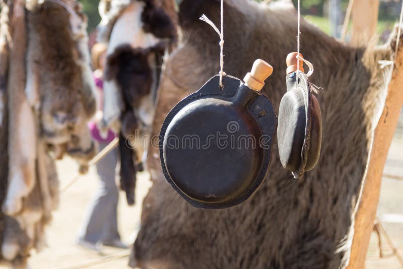 Leather Flask Hanging on Background of Animal Skin Stock Image - Image ...