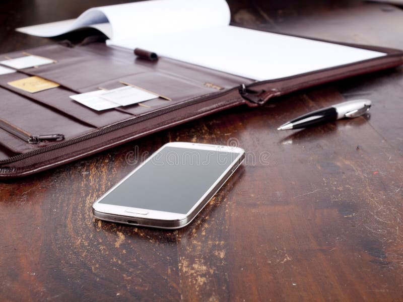 Leather Folder and a Modern Smartphone Stock Image - Image of modern ...