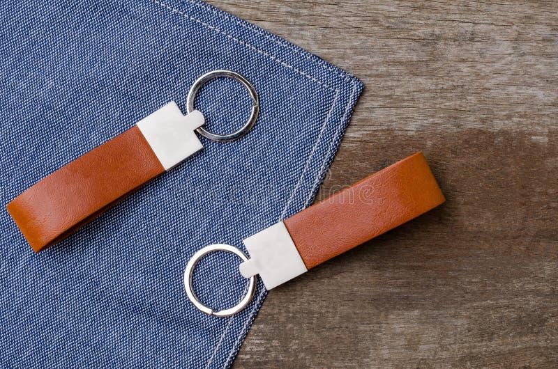 Leather Key Chain with Box on Blue Fabric Background Stock Image ...