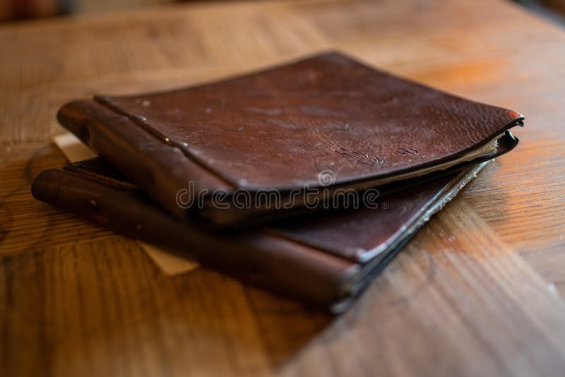 Leather Menu on a Wooden Table in a Retro Restaurant Bar Stock Photo ...