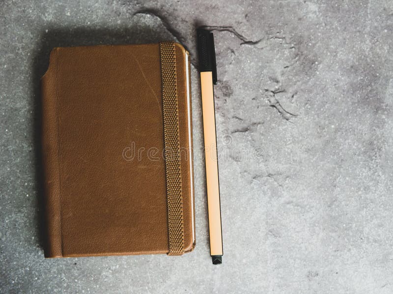 Leather notebook and pen stock photo. Image of leather - 244248230