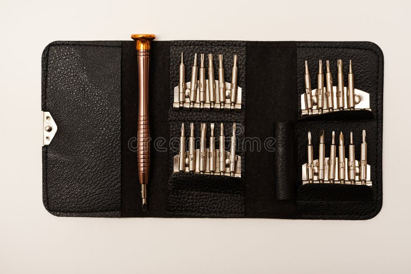 A Leather Purse with a Screwdriver and Bits. a Set of Different ...