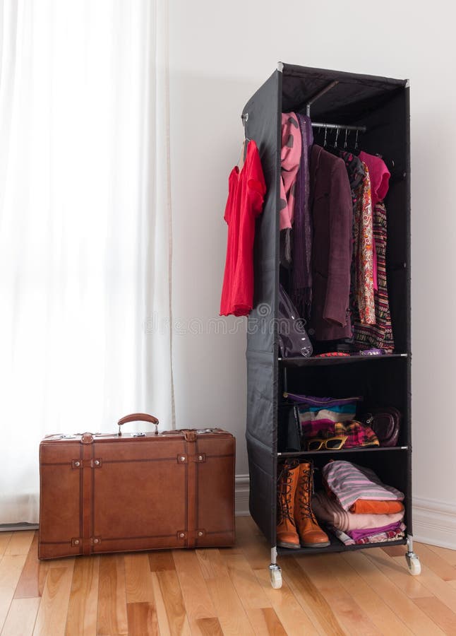 Leather Suitcase and Mobile Wardrobe with Clothing Stock Photo - Image ...