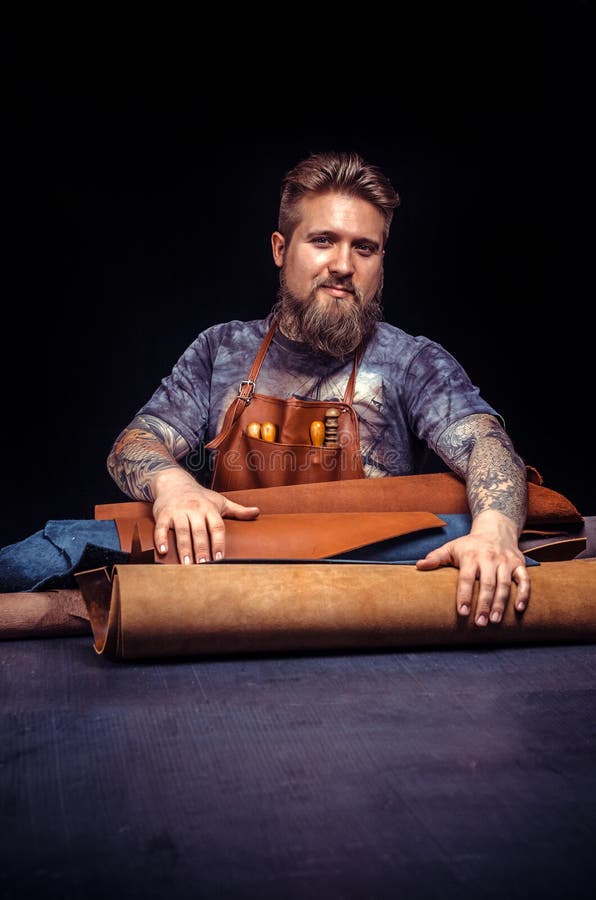 Leather Tanner Cuts Out Leather Goods in the Work Area Stock Image ...