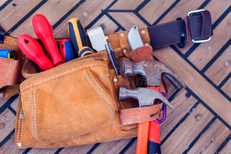 Leather Tool Belt with Construction Tooling on the Wooden Board ...