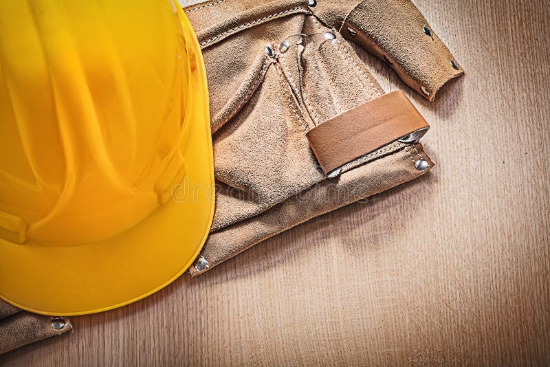 Leather Tool Belt Protective Hard Hat on Wood Board Stock Photo - Image ...