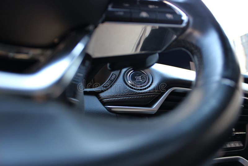 Engine Button is Visible through Defocused Steering Wheel Stock Photo ...