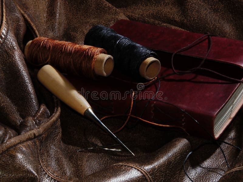 Leather Working Tools with Leather Book Stock Photo - Image of thread ...