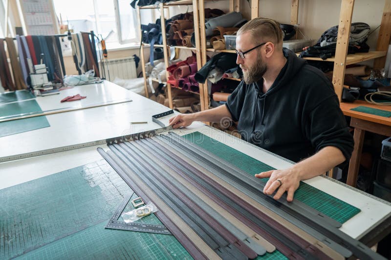 Leatherworker Making Leather Belts in Workshop. Stock Image - Image of ...