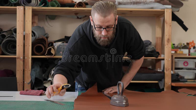 Leatherworker Measuring and Cutting Leather in Workshop. Stock Footage ...
