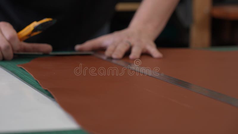 Leatherworker Measuring and Cutting Leather in Workshop. Stock Footage ...