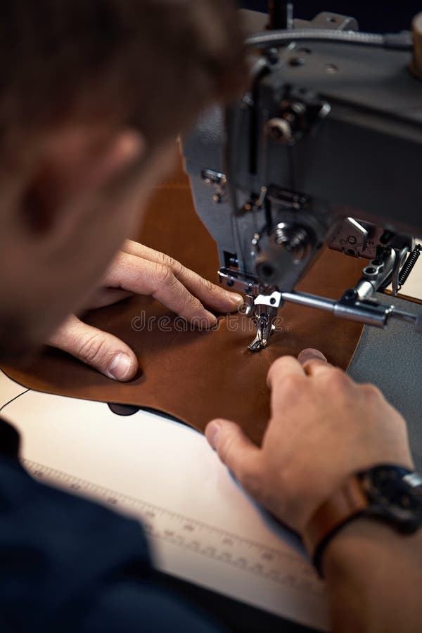 Leatherworker Workflow. a Tanner or Skinner Sews Leather on a Special ...