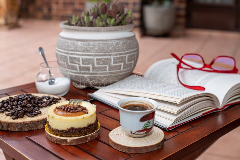 Coffee on a Table with Reading Glasses and a Book Stock Image - Image ...