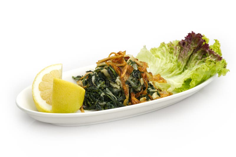 Lebanese Food of Cooked Hindbeh with Fried Onion and Lemon Stock Image ...