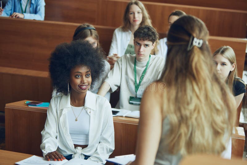 Lecturer Interacting with Students Attending Workshop. Well-lit ...