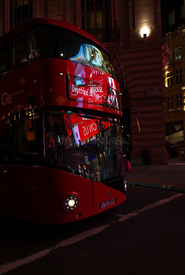 LED Billboard Lights, Reflected on Front Windows of London Bus ...