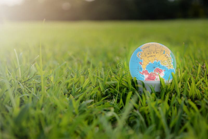 LED Bulb As a Earth on the Grass for Eco Concept Stock Photo - Image of ...