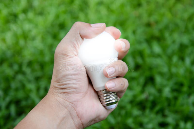 LED Bulb - Energy in Our Hand with Lighting Stock Image - Image of ...