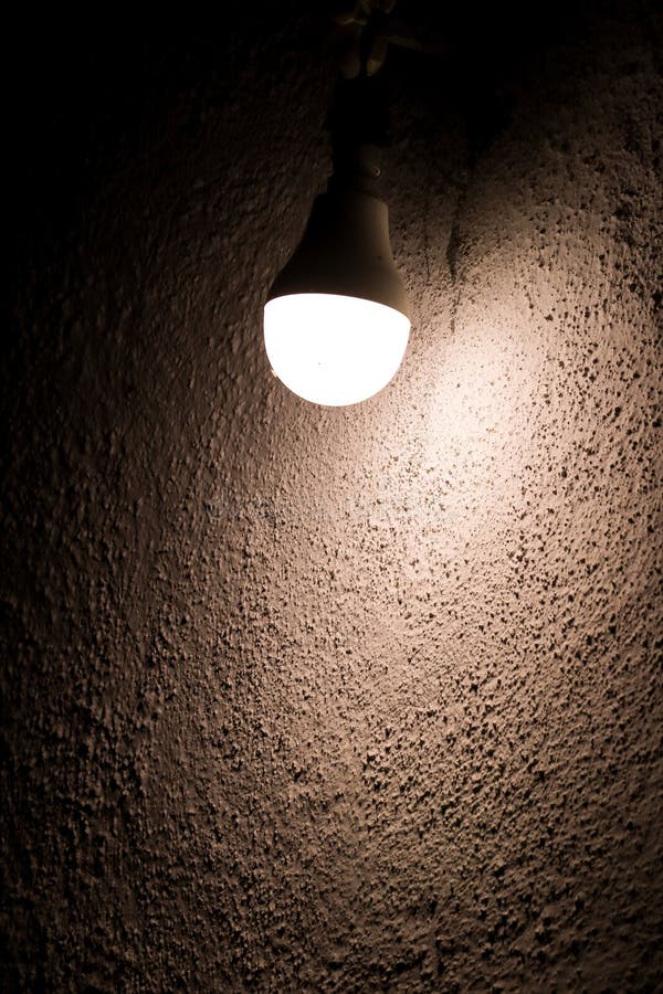 LED Bulb and Simple Light Bulb on Dark Background, Concept of ...