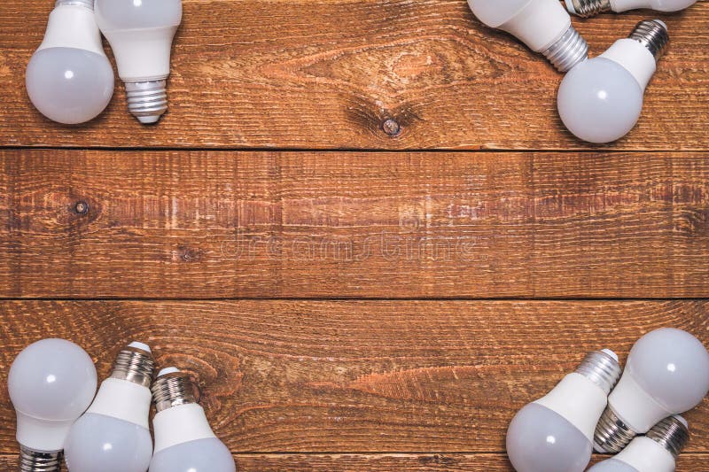 LED Bulbs are Lying on the Table in Different Corners of the Frame ...