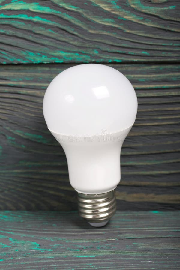 LED Bulbs on Pine Boards Painted in Black and Green. Green Technology ...