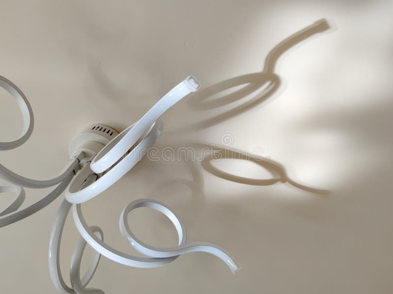 LED Chandelier and Its Shadow on the Ceiling in Sunlight Stock Photo ...
