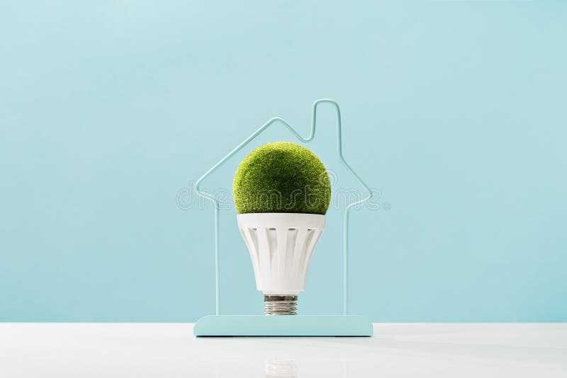 LED Green Grass Light Bulb Blue Background. Green Energy Stock Image ...