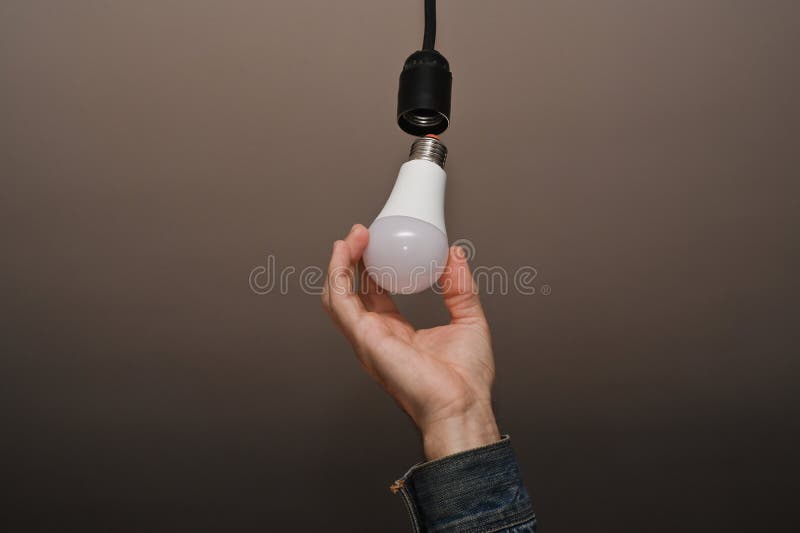 LED lamp in hand. close-up stock photo. Image of incandescent - 270895658