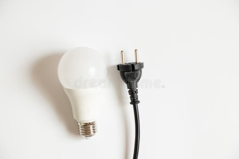 LED Lamp and a Plug with a Wire Lie on a White Background, Current and ...